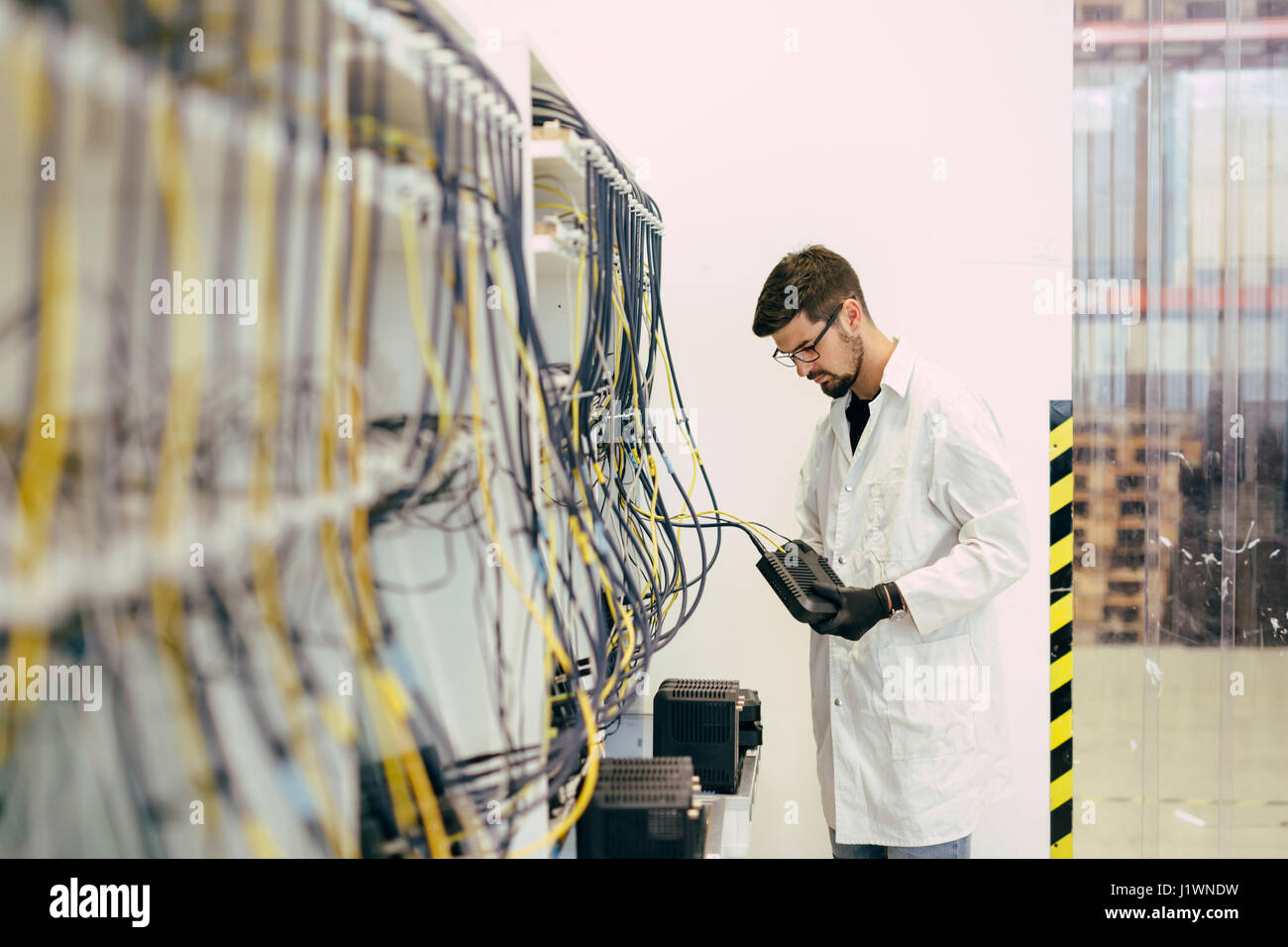 Professional network hardware inspection Stock Photo - Alamy