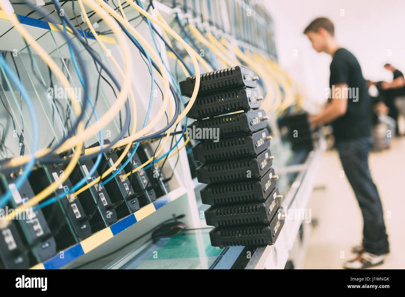 People checking refurbished hardware Stock Photo - Alamy