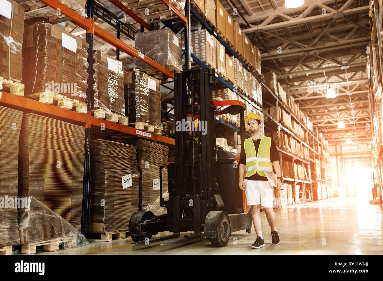 Logistics people working in warehouse Stock Photo - Alamy