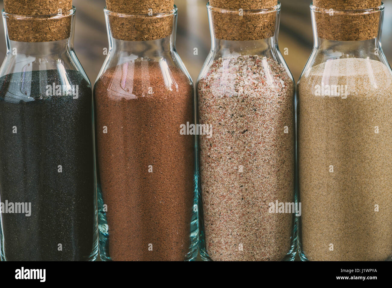 Bottles with colored sand Stock Photo - Alamy