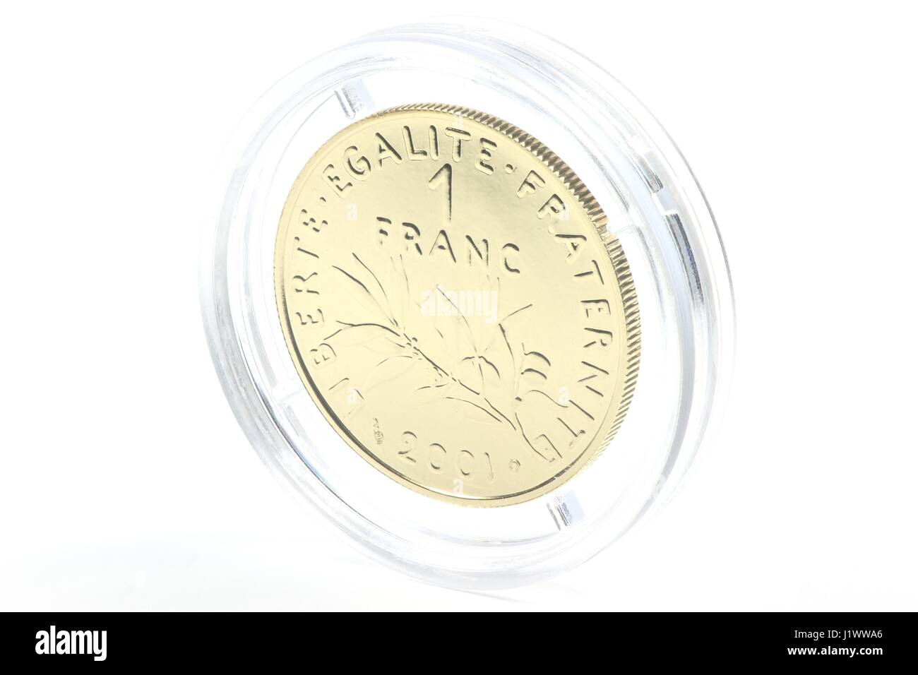 special gold issue of the French 1 Franc coin isolated on white ...