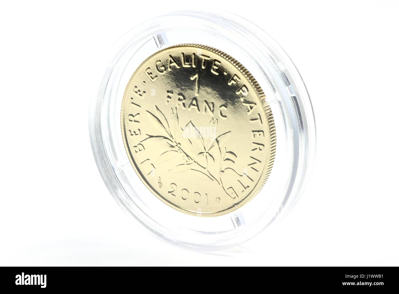 special gold issue of the French 1 Franc coin isolated on white ...