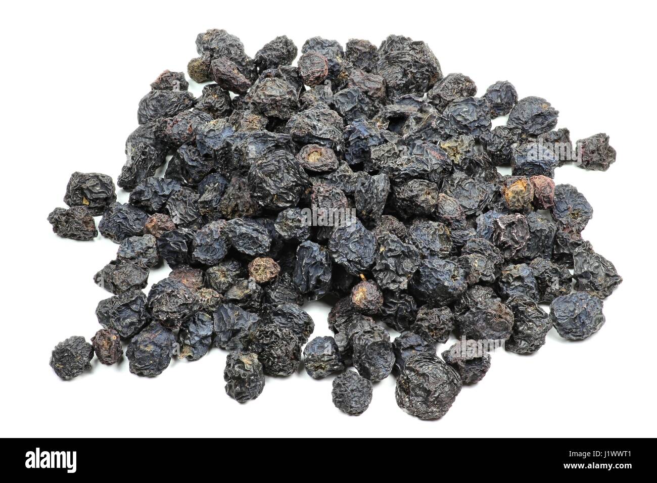 dried aronia berries isolated on white background Stock Photo - Alamy