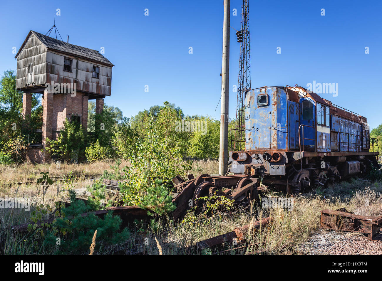 Old engine and railway building op abandoned Yaniv town railway station ...