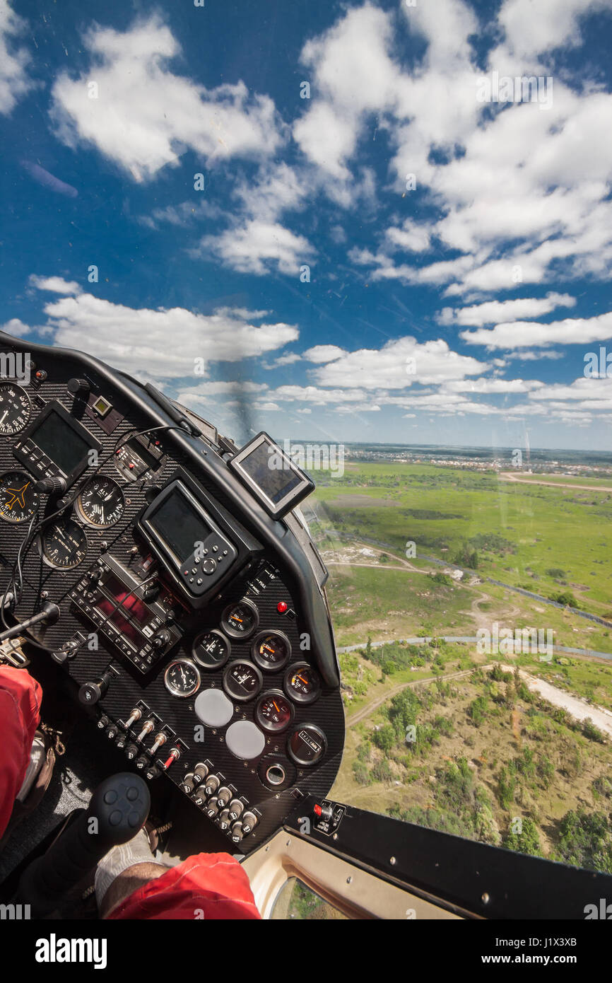 Pilots flying a light private plane and making a roll in a sunny summer ...