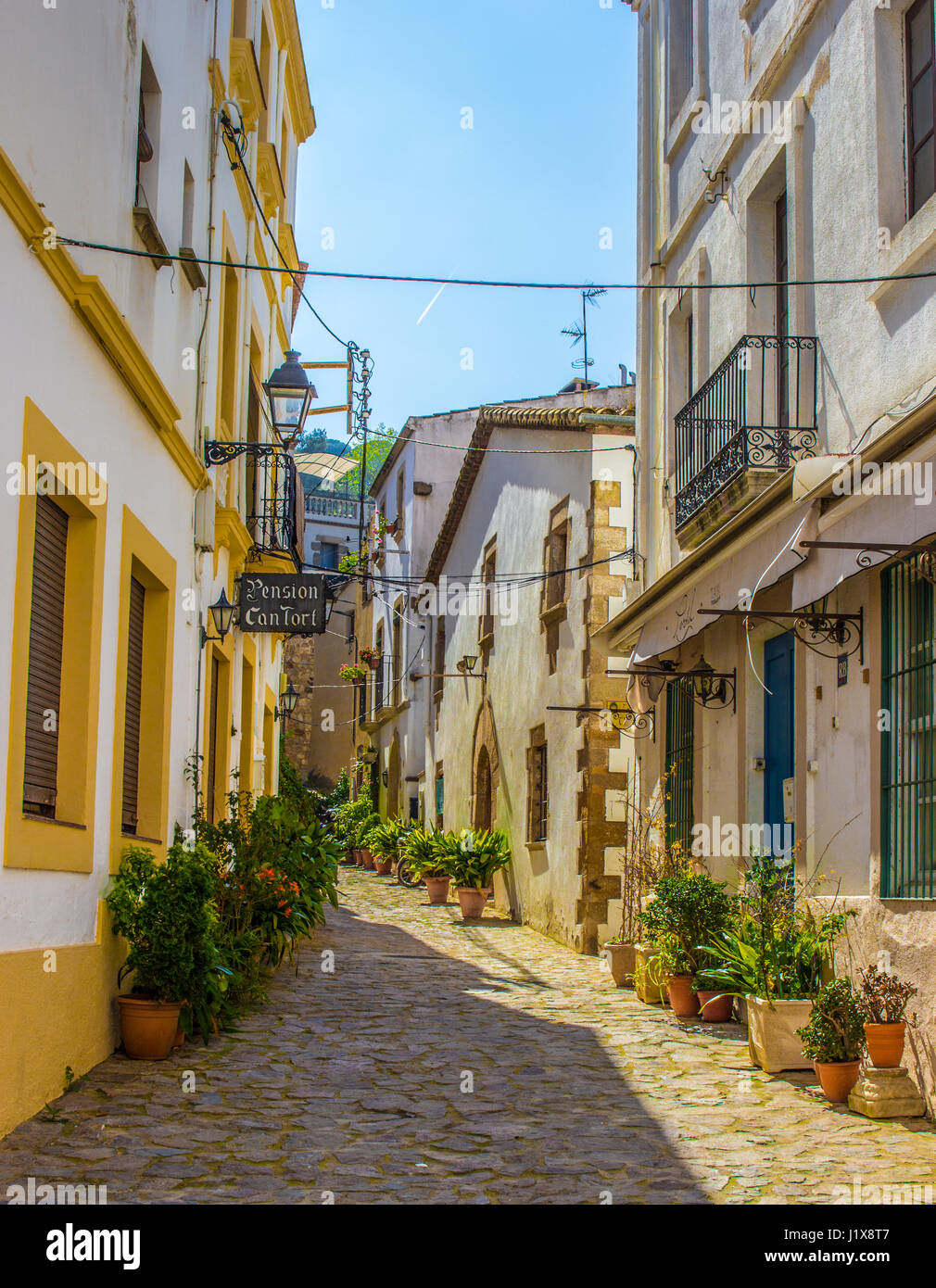 A typical Spanish Street/ Road with Terraced Houses Stock Photo - Alamy