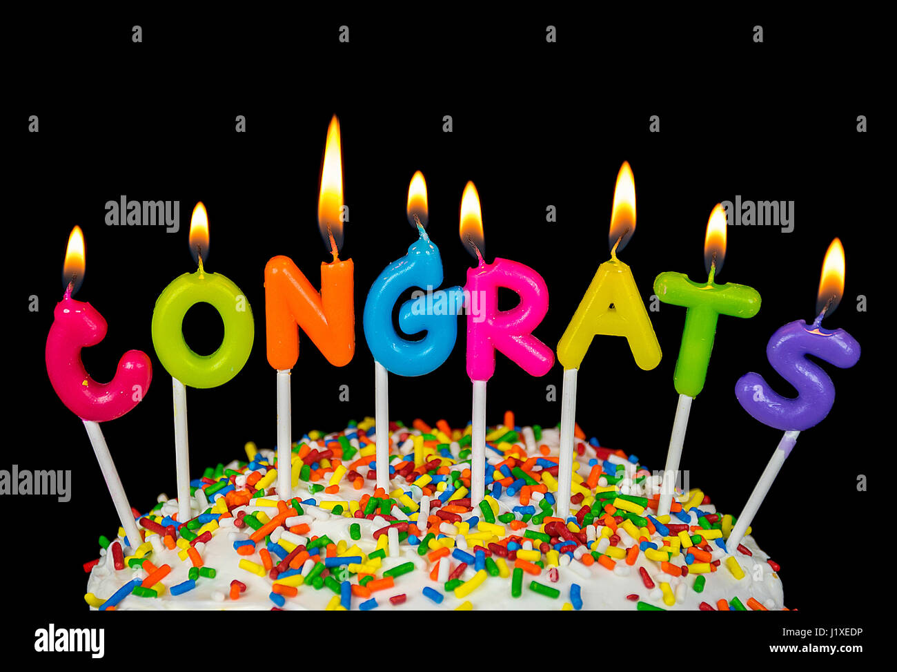 congrats candle on white cake with candy sprinkles Stock Photo - Alamy