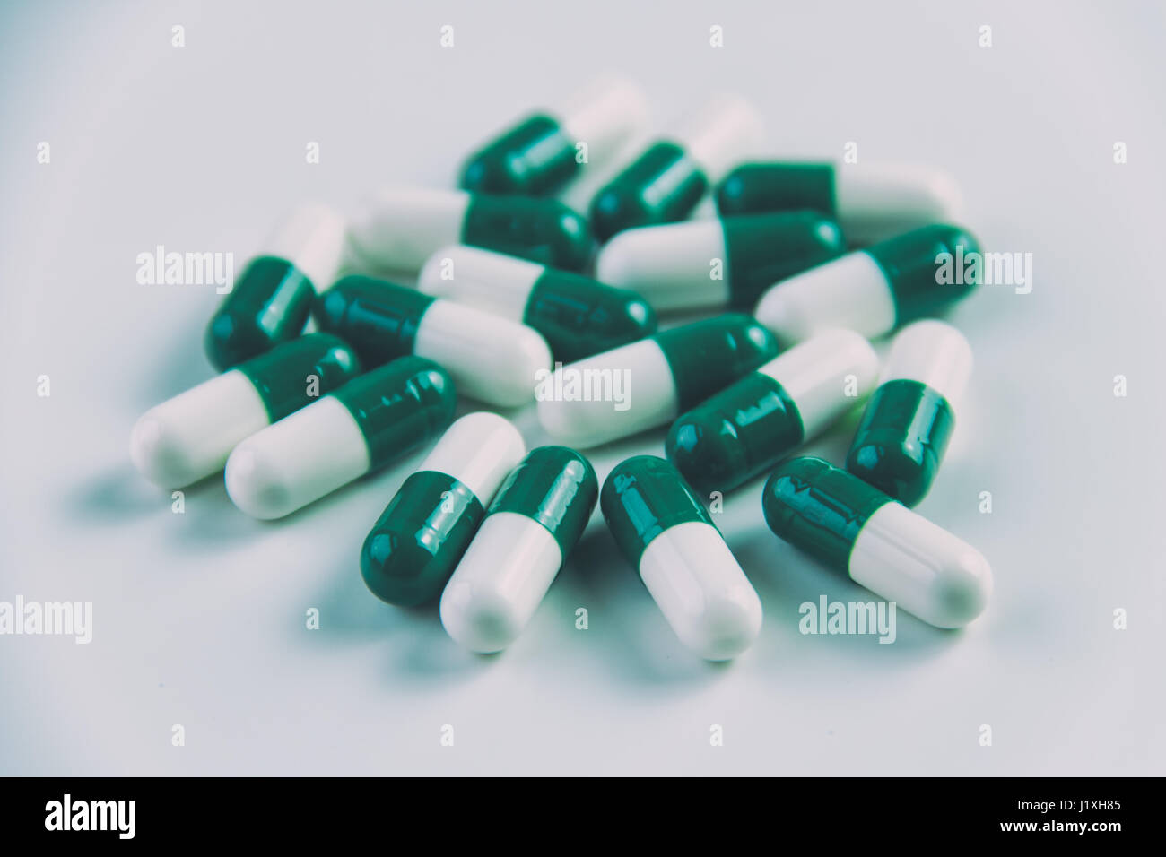 Group of generic pills with white background Stock Photo - Alamy