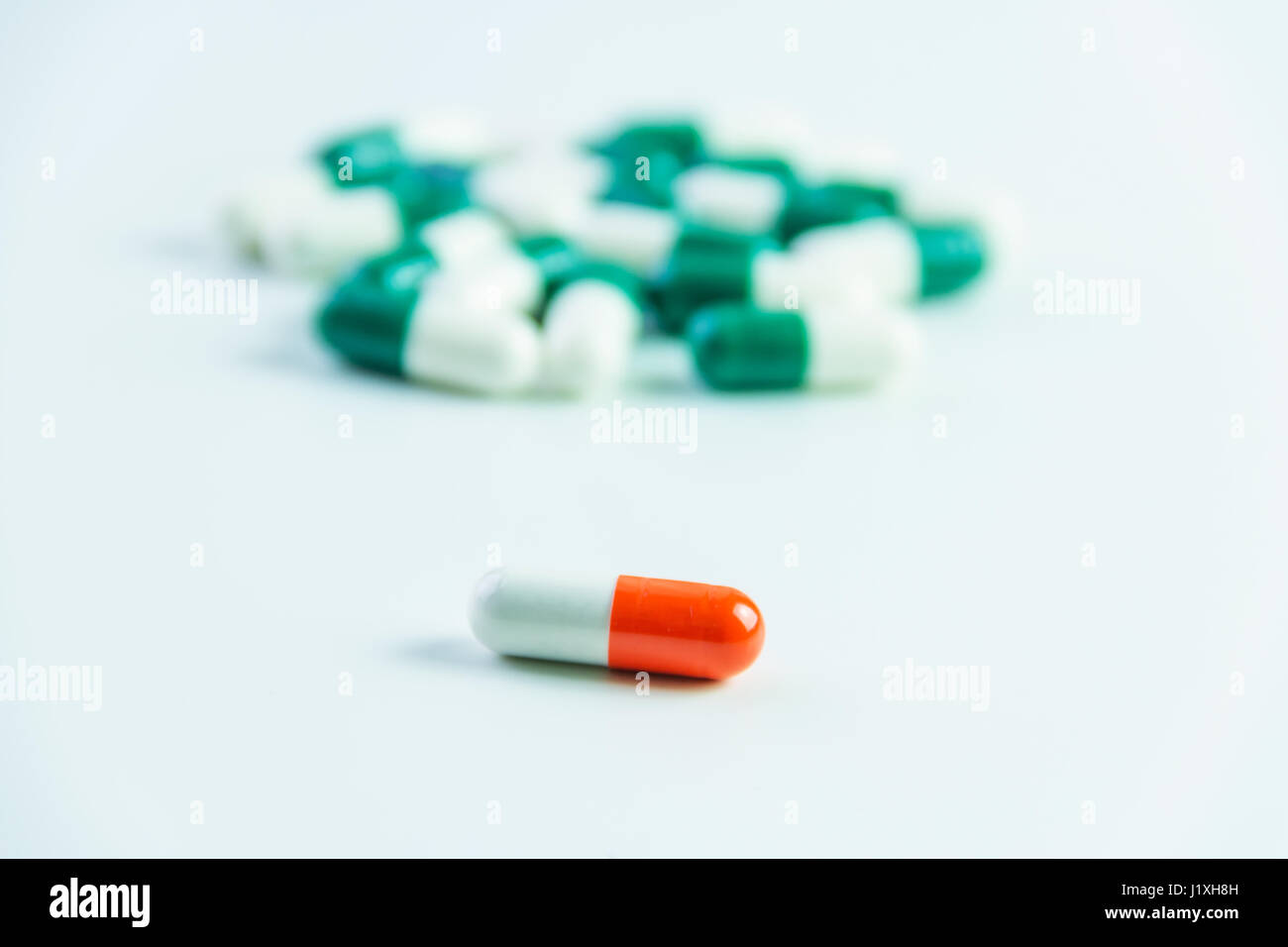 Group of generic pills with white background Stock Photo - Alamy
