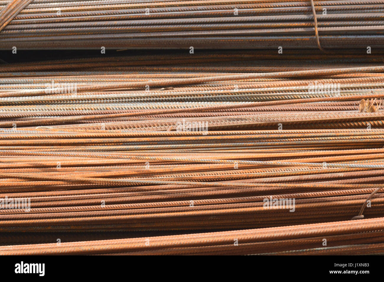 Iron rusty brown bars for construction in a set Stock Photo - Alamy