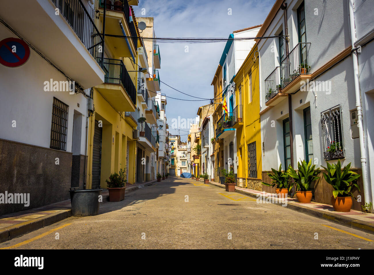 A typical Spanish Street/ Road with Terraced Houses Stock Photo - Alamy