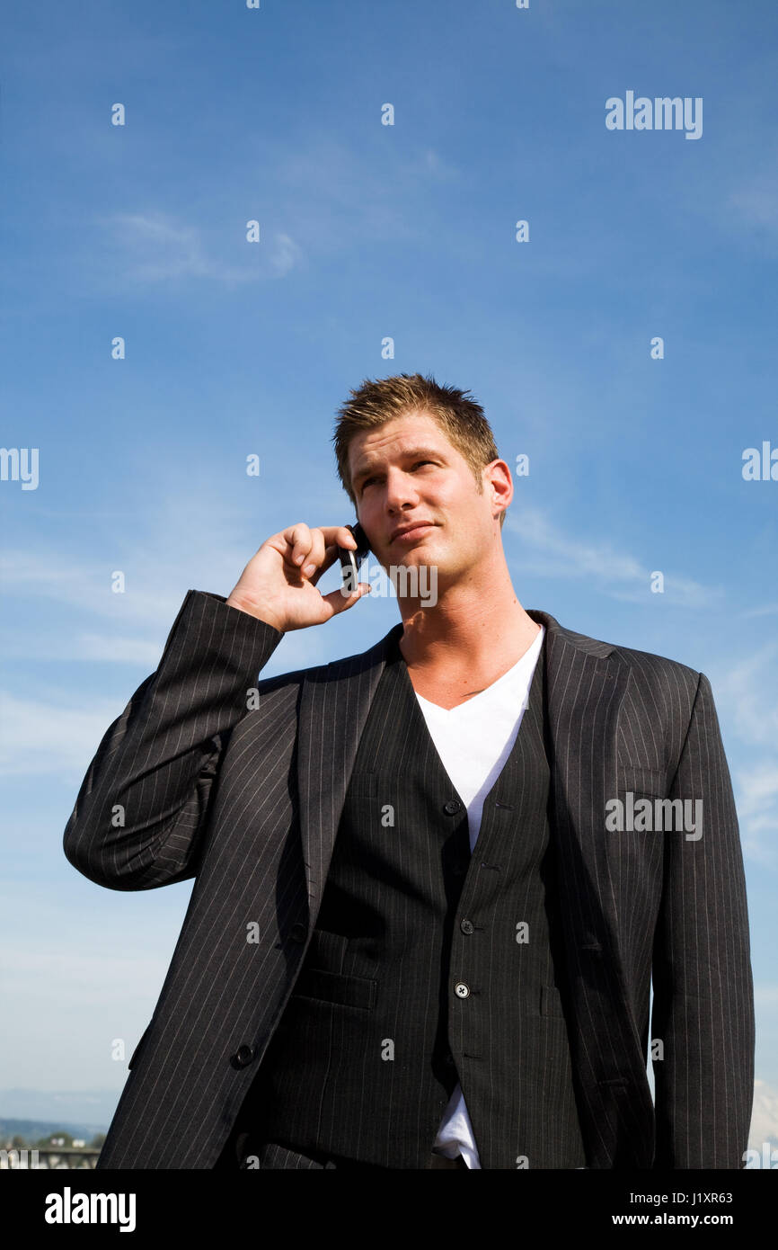 A caucasian businessman talking on the phone outdoor Stock Photo - Alamy