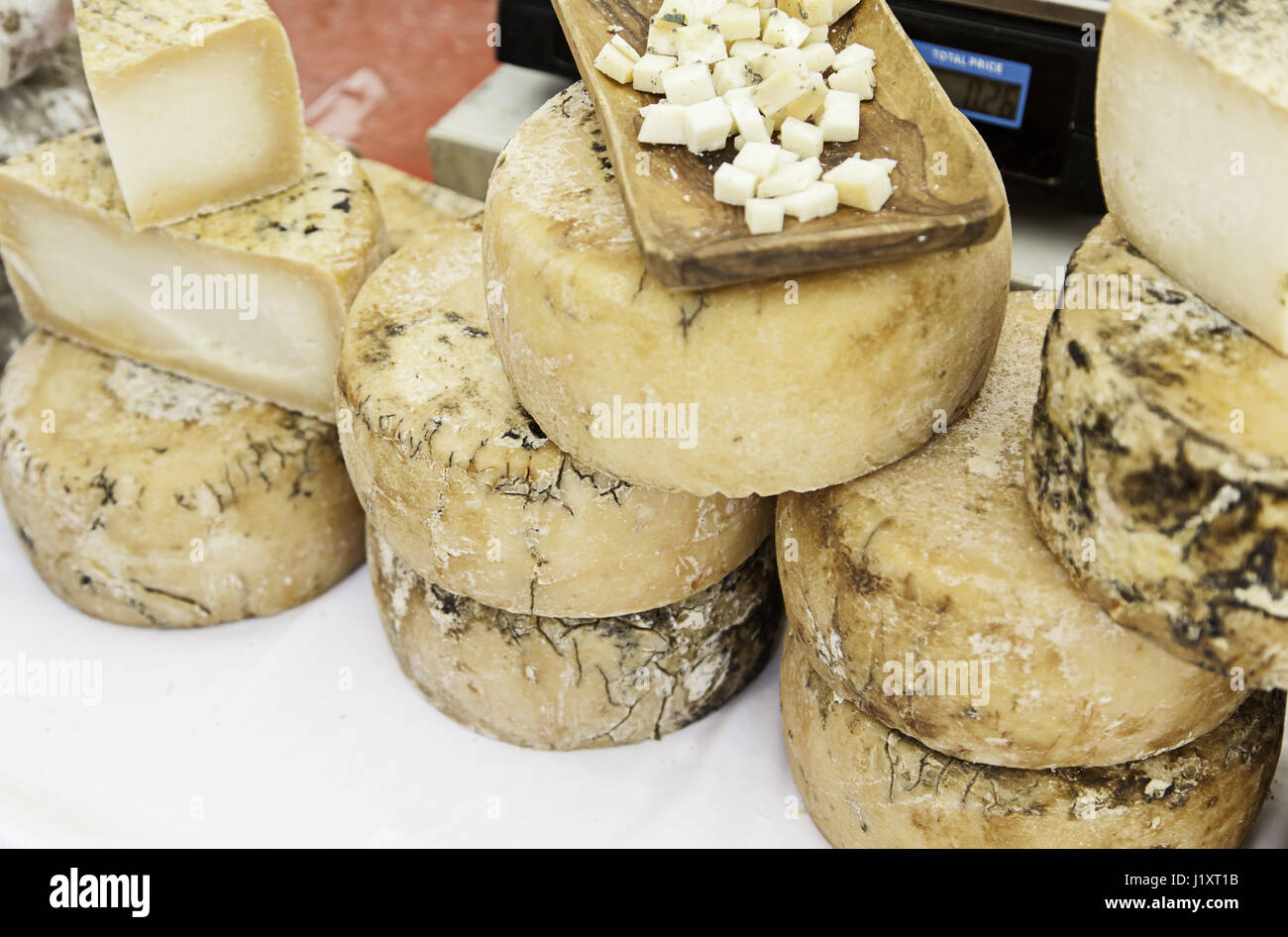 Artisan cheese in a market, detail of food, food and tradition, dairy ...