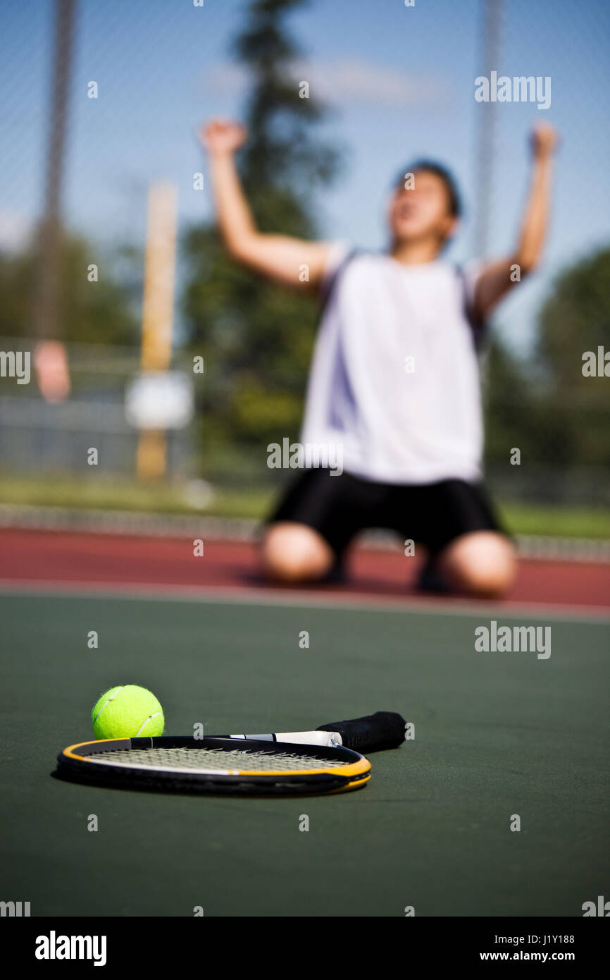 A happy tennis player in joy after winning Stock Photo - Alamy
