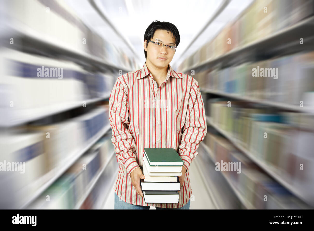 An asian college student carrying books at the library Stock Photo - Alamy