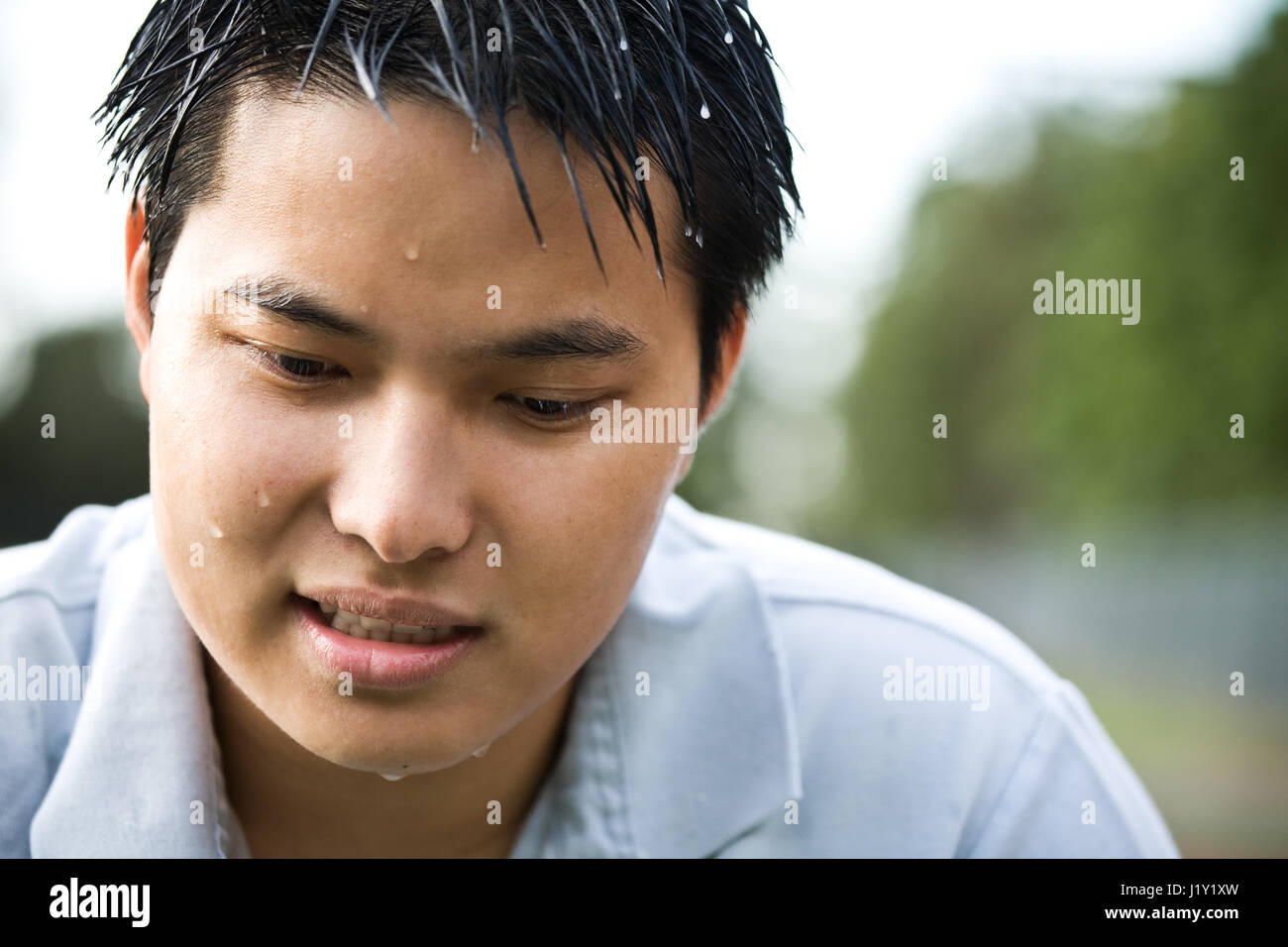 A shot of a sad and depressed asian man Stock Photo - Alamy