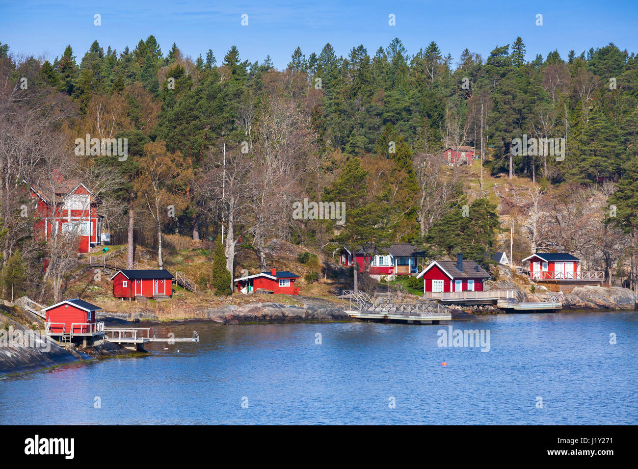 Swedish rural landscape, coastal village with red wooden houses and ...