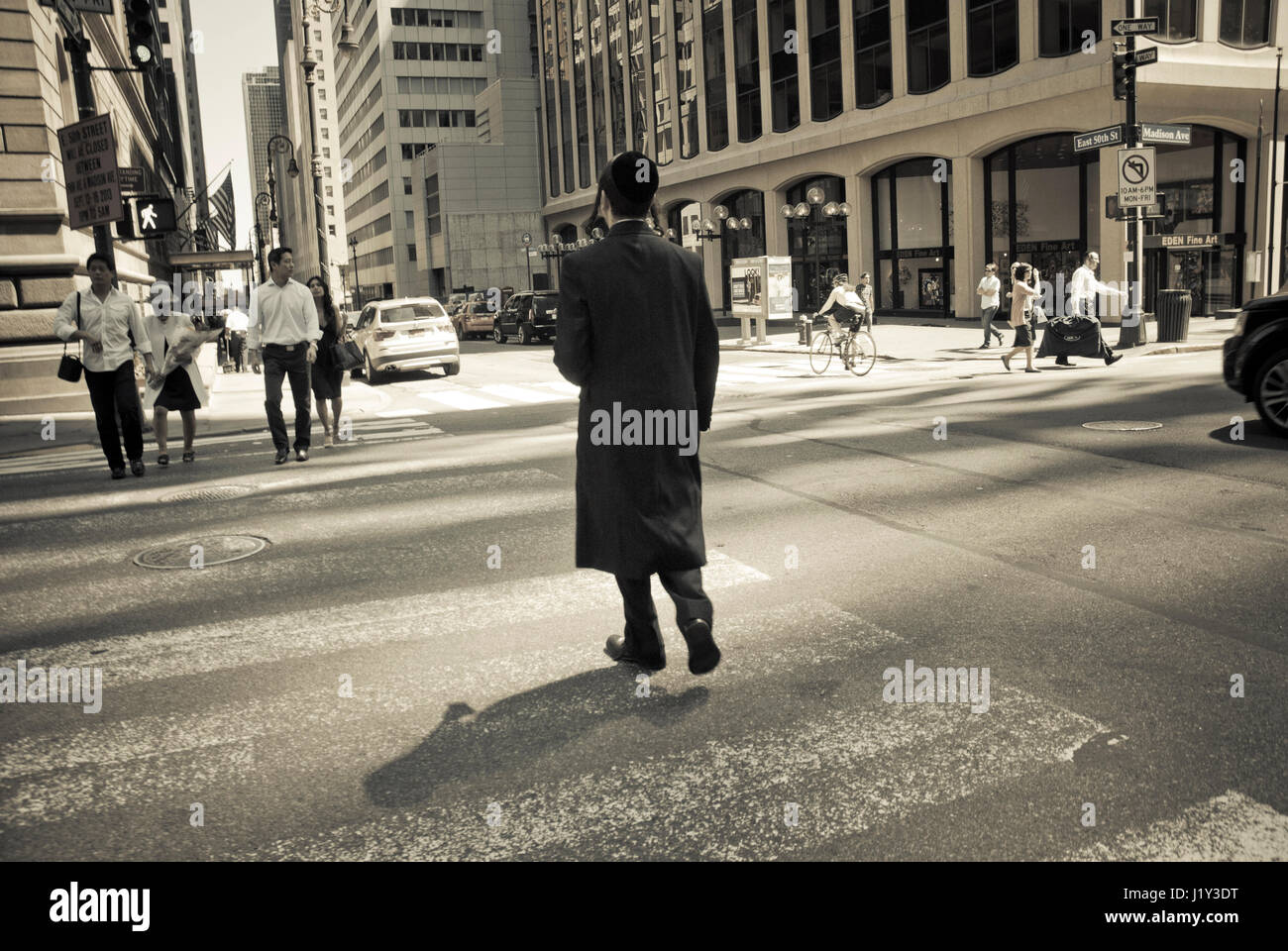 Jewish person in traditinal attire crossing street in New York City ...