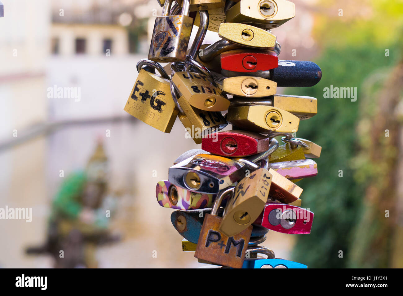 Colorful locks representing love locked onto a bridge Stock Photo - Alamy