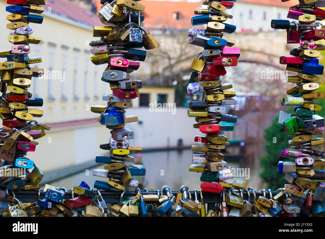 Colorful locks representing love locked onto a bridge Stock Photo - Alamy