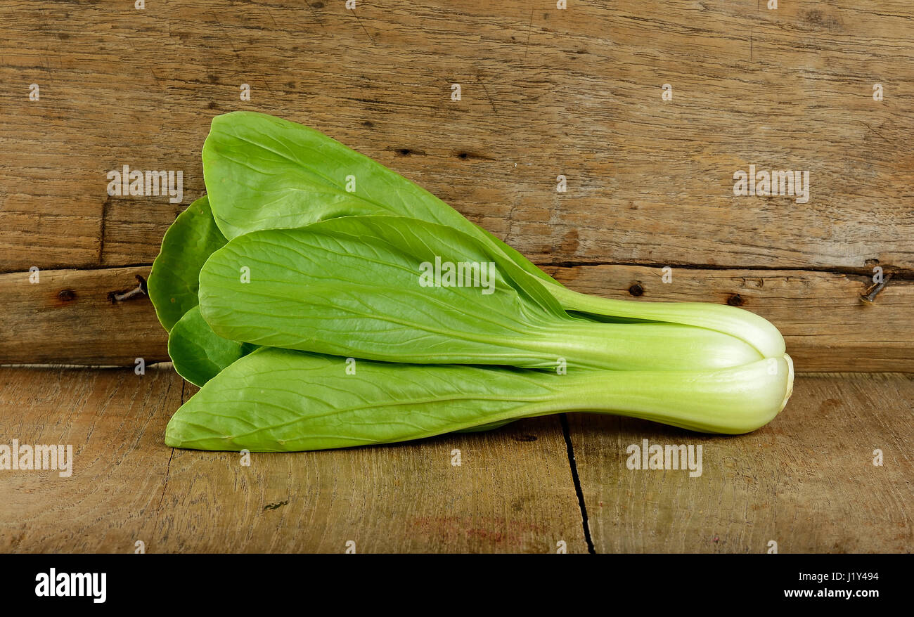 Bok choy vegetable on the wooden background Stock Photo - Alamy