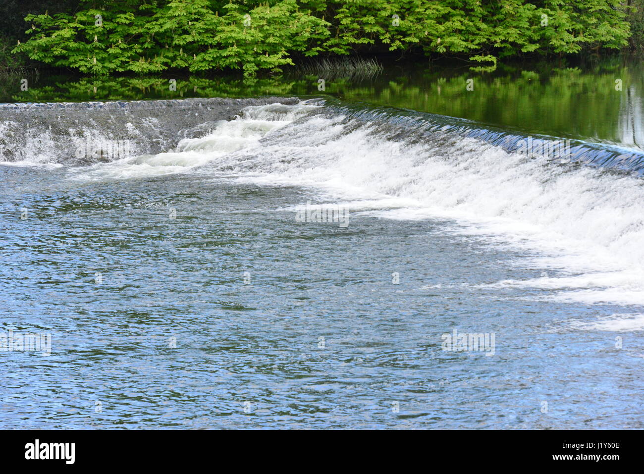 A water Weir at Cahir castle in Ireland Stock Photo - Alamy