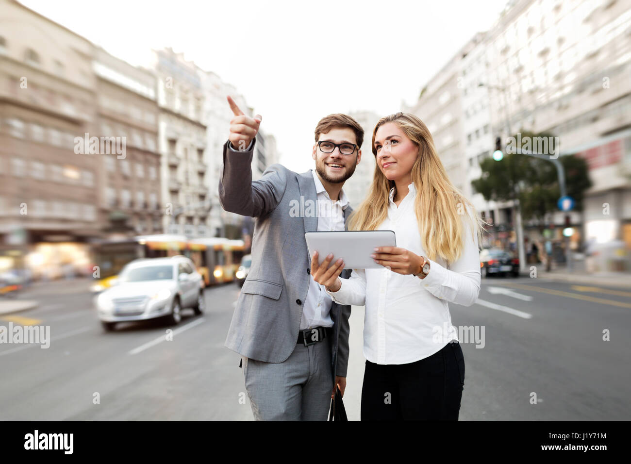 Businesspeople commuting and walking in busy city together Stock Photo ...