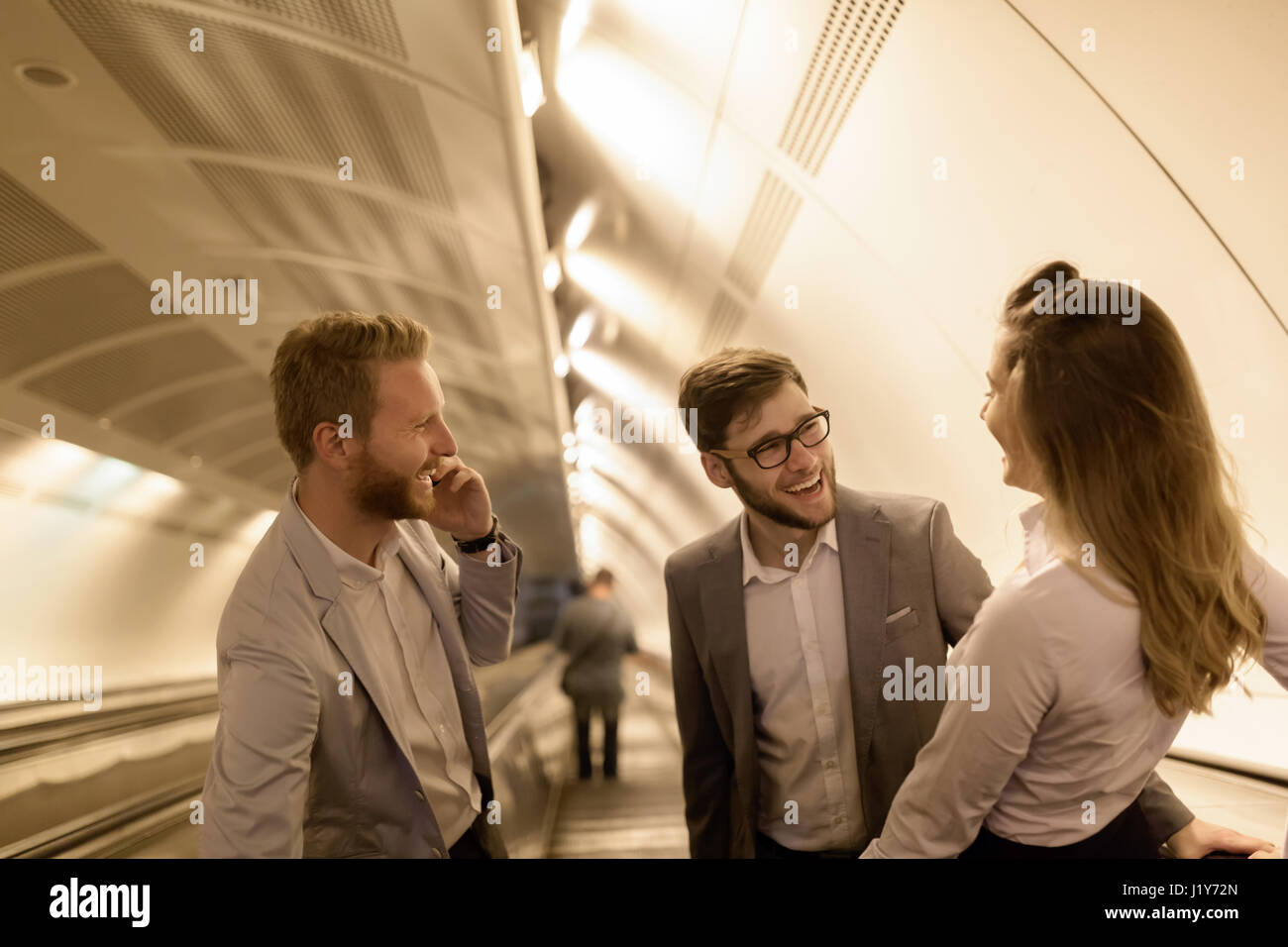 Coworkers using subway stairs together to get underground Stock Photo ...