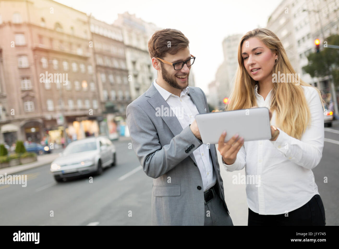Businesspeople commuting and walking in busy city together Stock Photo ...