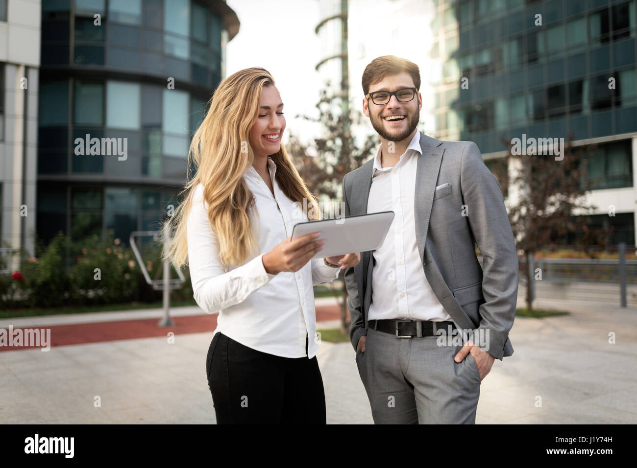 Business people commuting on street and talking Stock Photo - Alamy