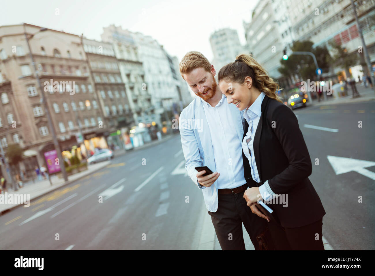Businesspeople commuting and walking in busy city together Stock Photo ...