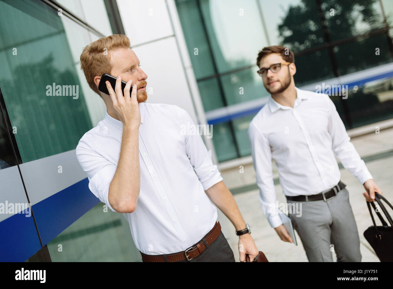 Business people going to work and carrying smart technology Stock Photo ...