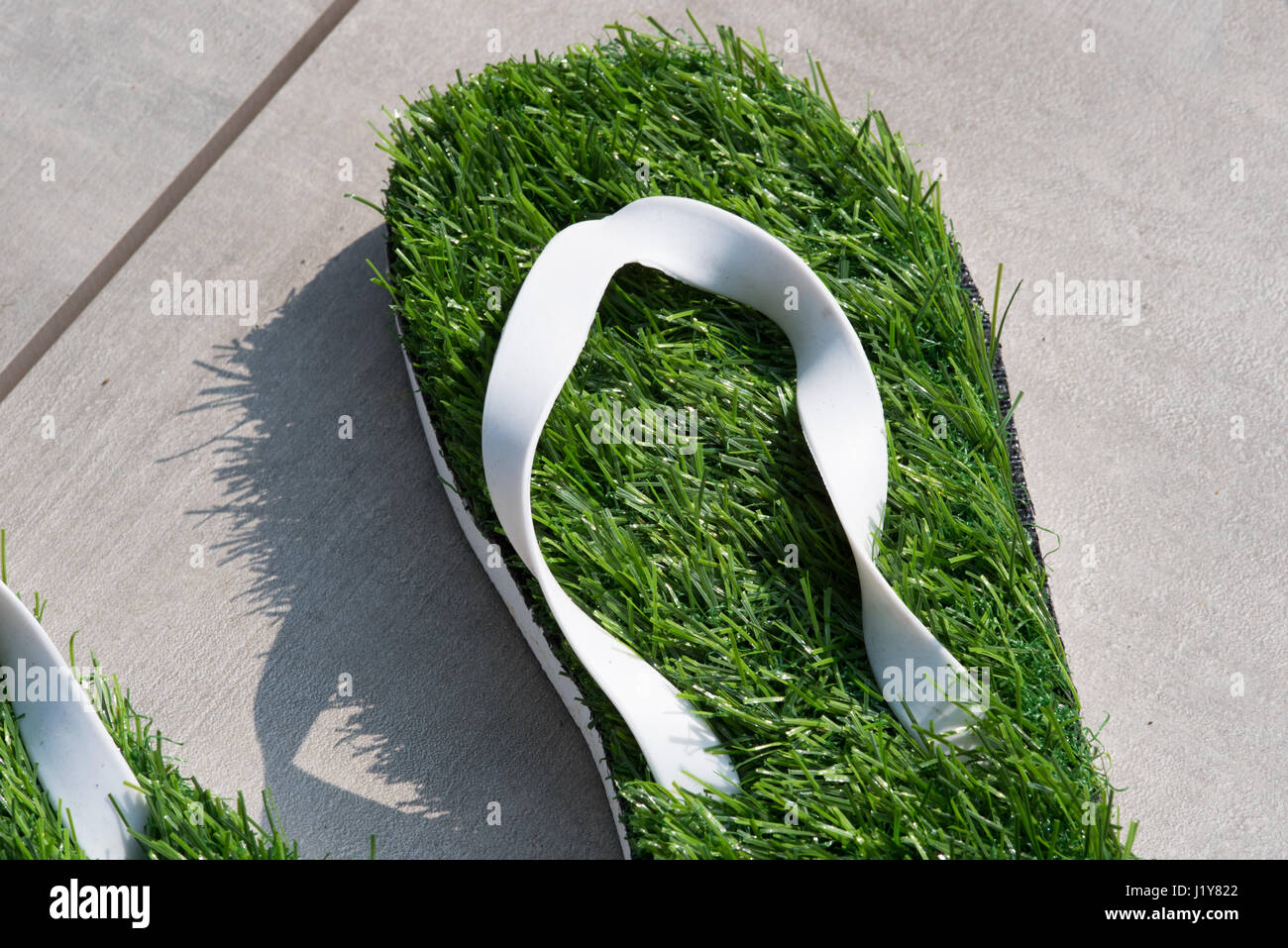 Grass flip flop hi-res stock photography and images - Alamy