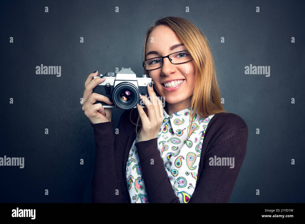 Cute girl with her camera, concept I love photography Stock Photo - Alamy