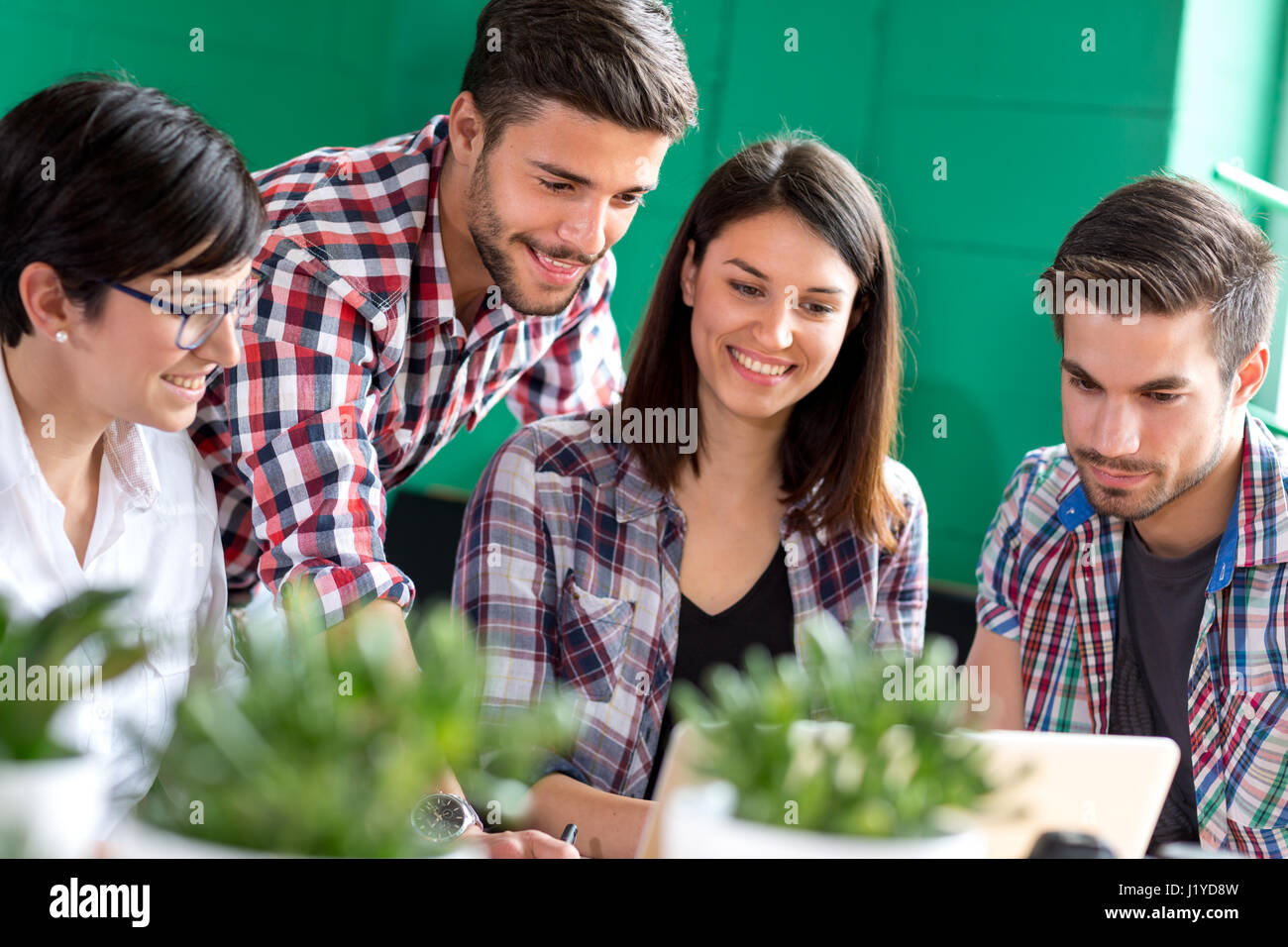Group of young people studying in coffee shop Stock Photo - Alamy