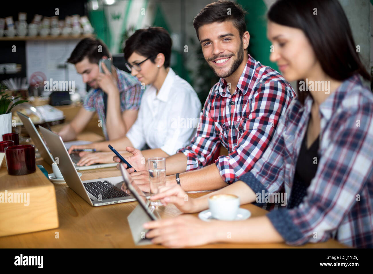 students studying and learning in a coffee shop with a laptop Stock ...