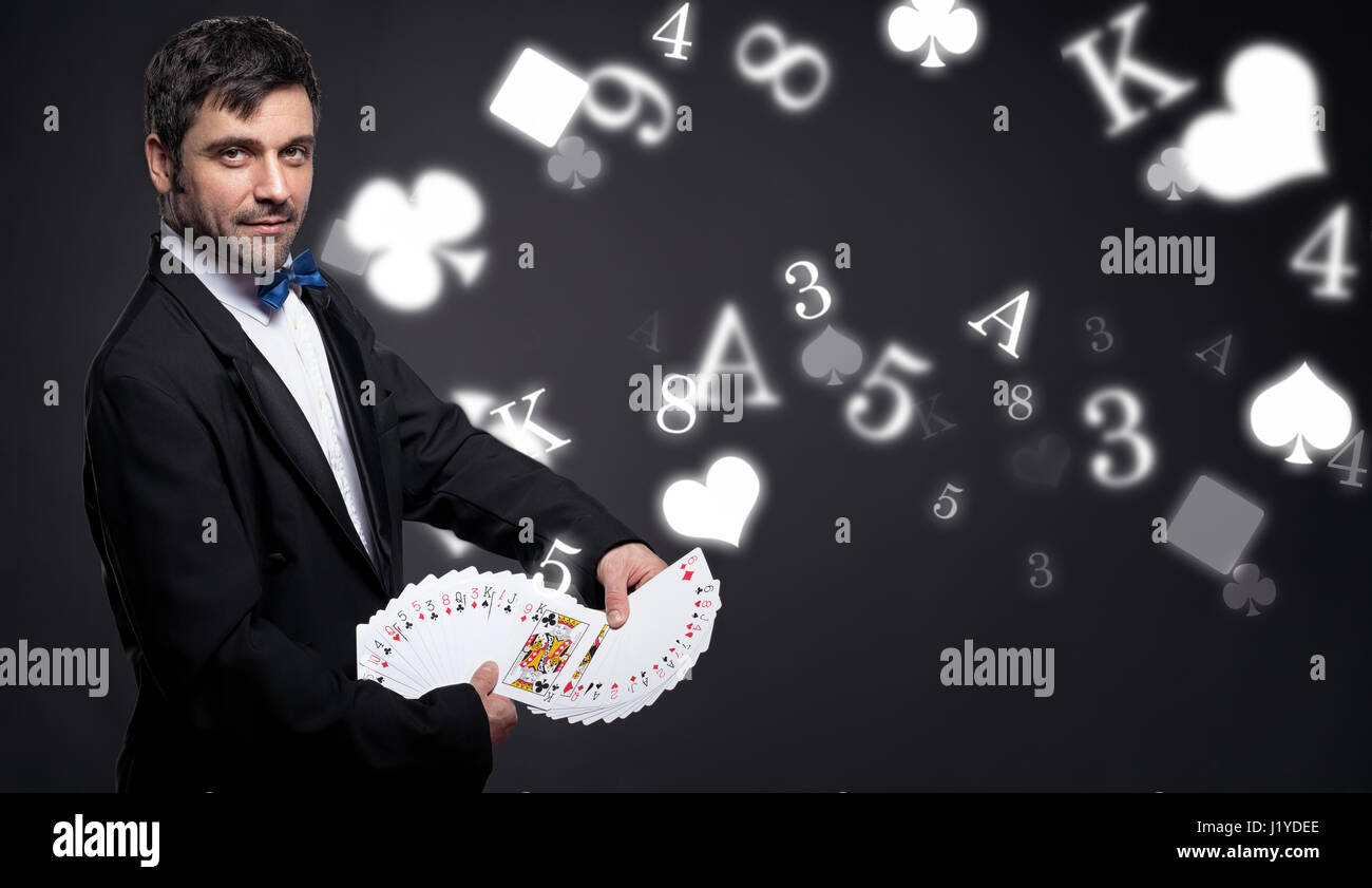 Illusionist showing trick playing cards hi-res stock photography and ...
