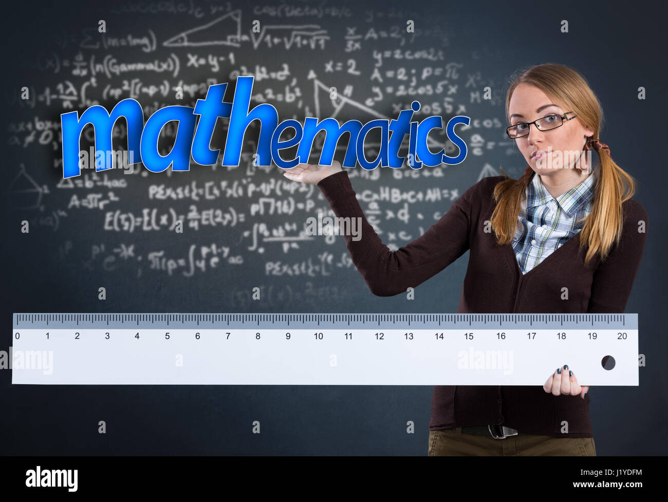 Student girl with big ruler and mathematics word Stock Photo - Alamy