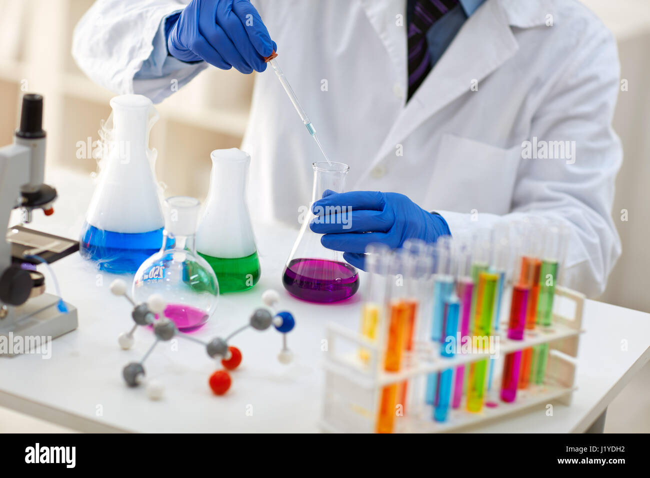 reaction testing in chemical laboratory science Stock Photo - Alamy