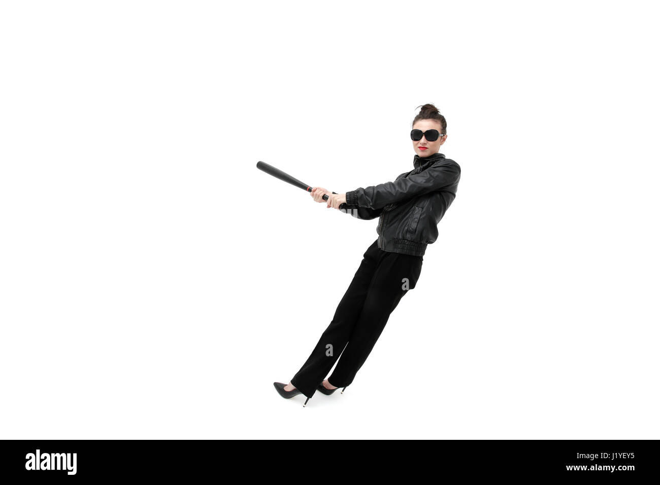 Portrait of an angry woman with a bat, isolated on white background ...