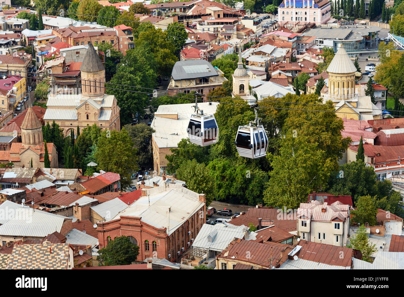 Top view on car of cableway under roof of houses Old city Tbilisi ...