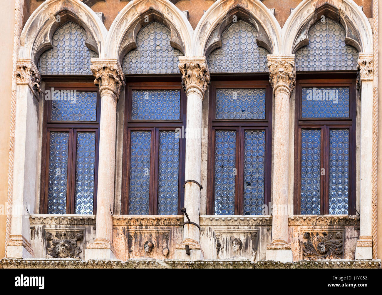travel to Italy - window of medieval palazzo thiene on street contra ...