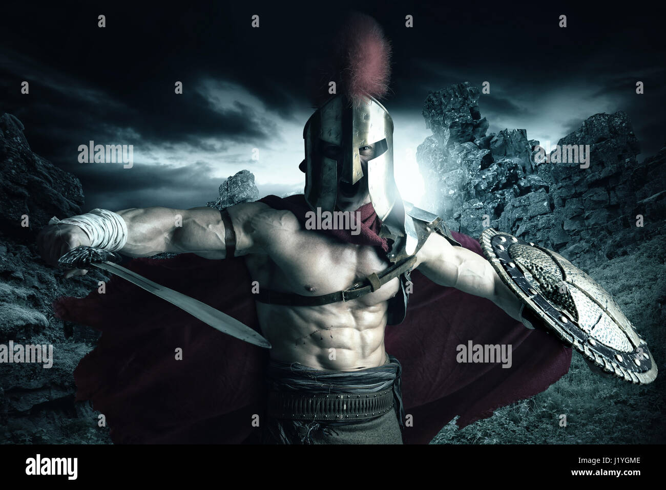 Ancient warrior or Gladiator posing outdoors with helmet Stock Photo ...