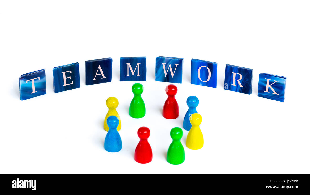 Mosaic tiles with letters and board game pieces - Concept of teamwork ...