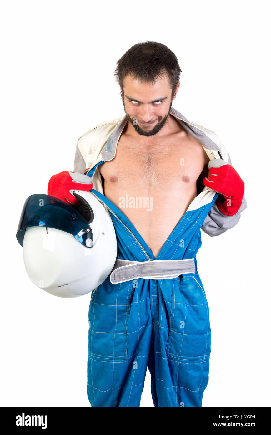 Racing driver posing with helmet showing chest isolated in white Stock ...