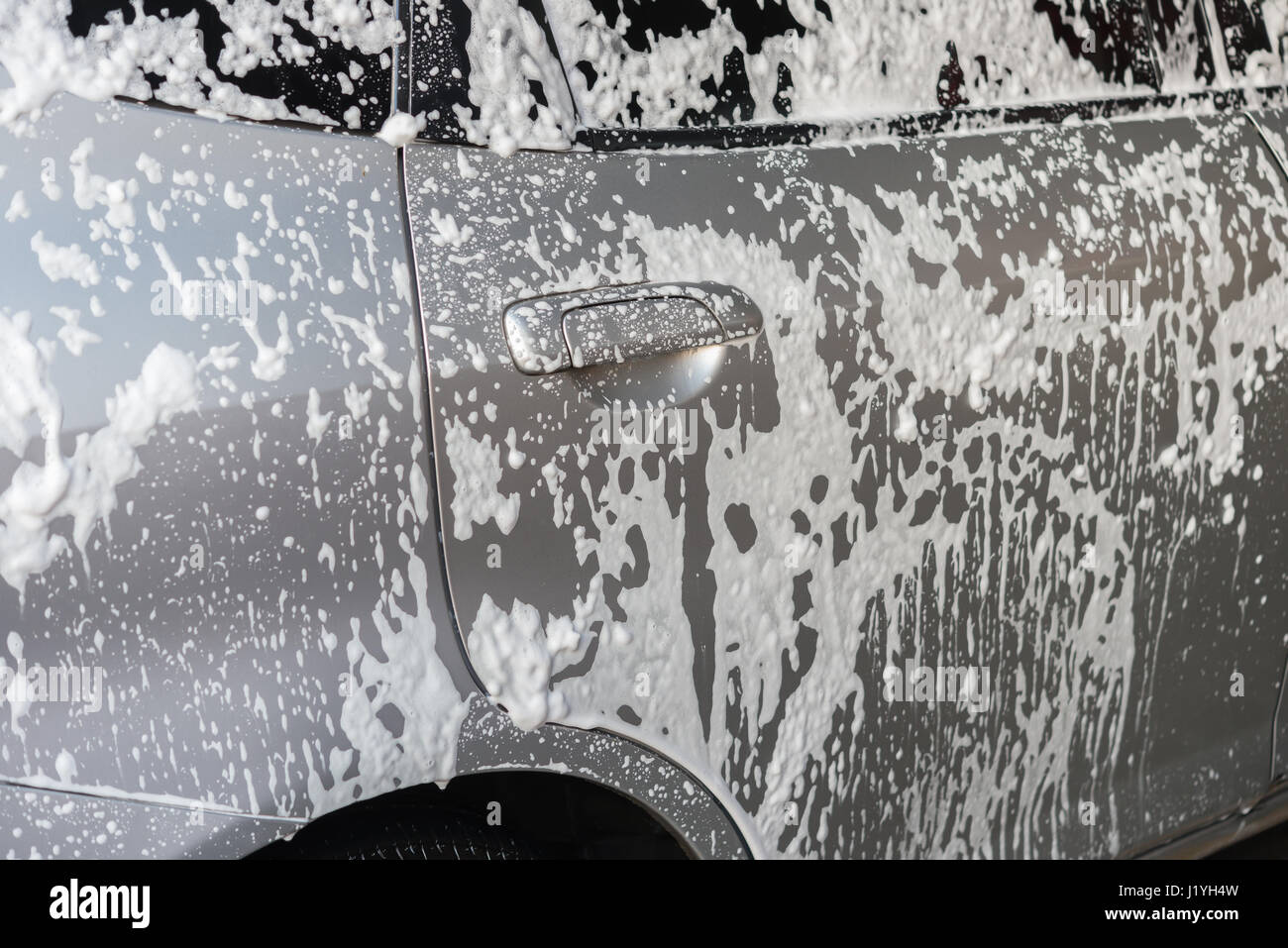 washing a car with soapy water Stock Photo - Alamy