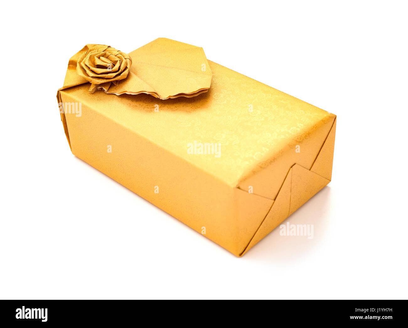 wrapped golden present box on white background Stock Photo - Alamy