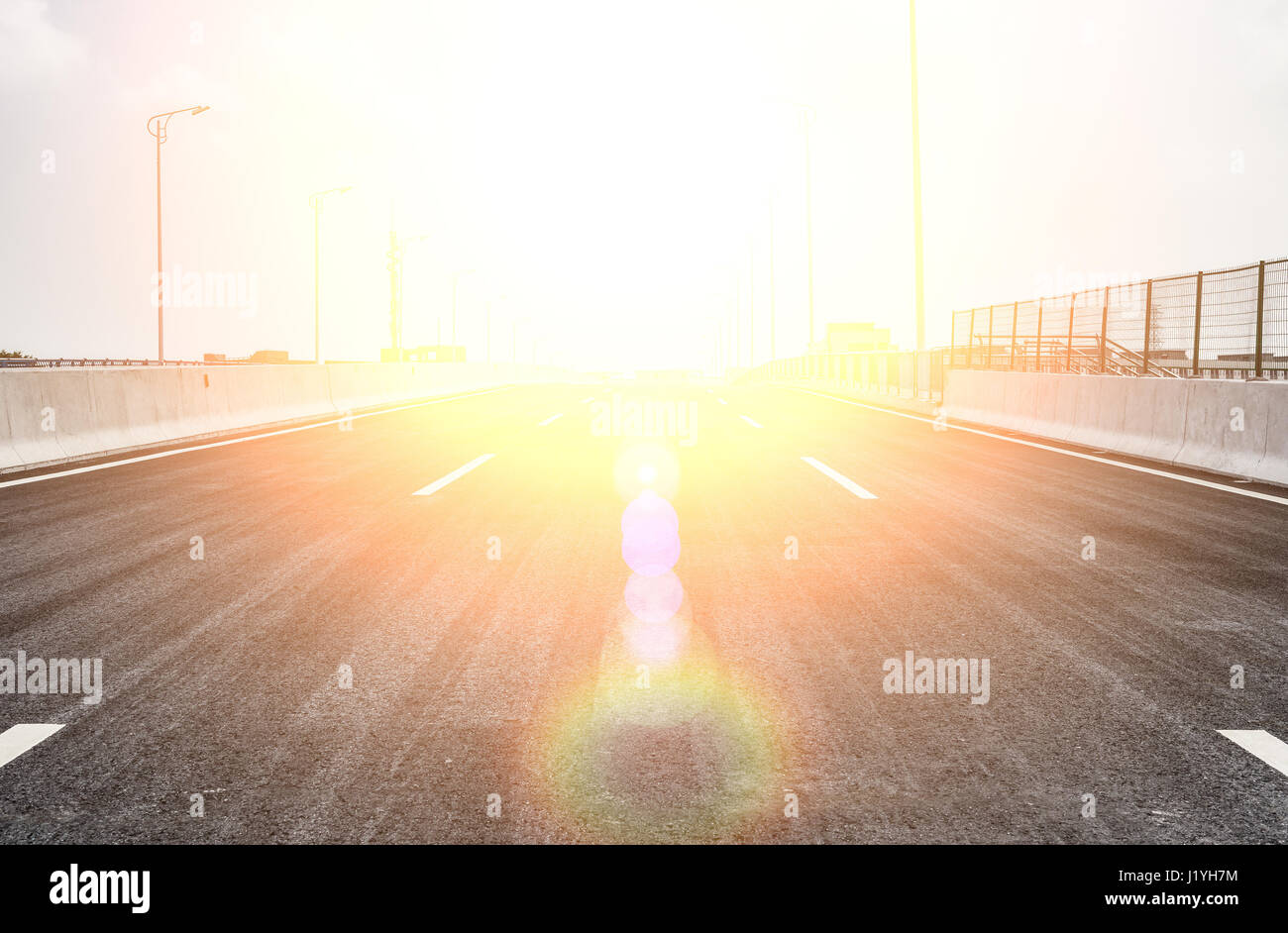 blacktop with a big sun on top middle Stock Photo - Alamy