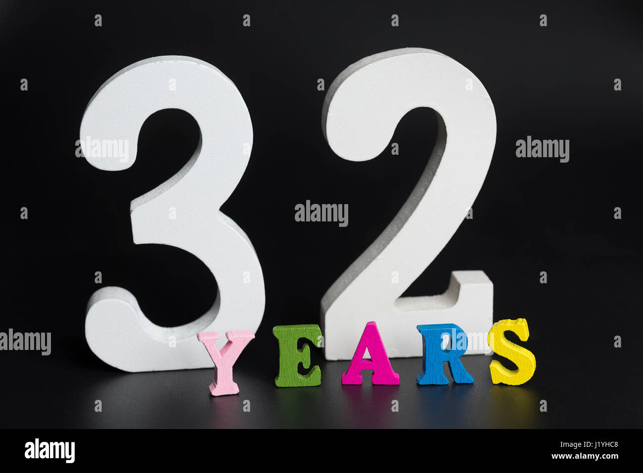 Letters and numbers thirty-two on a black isolated background Stock ...