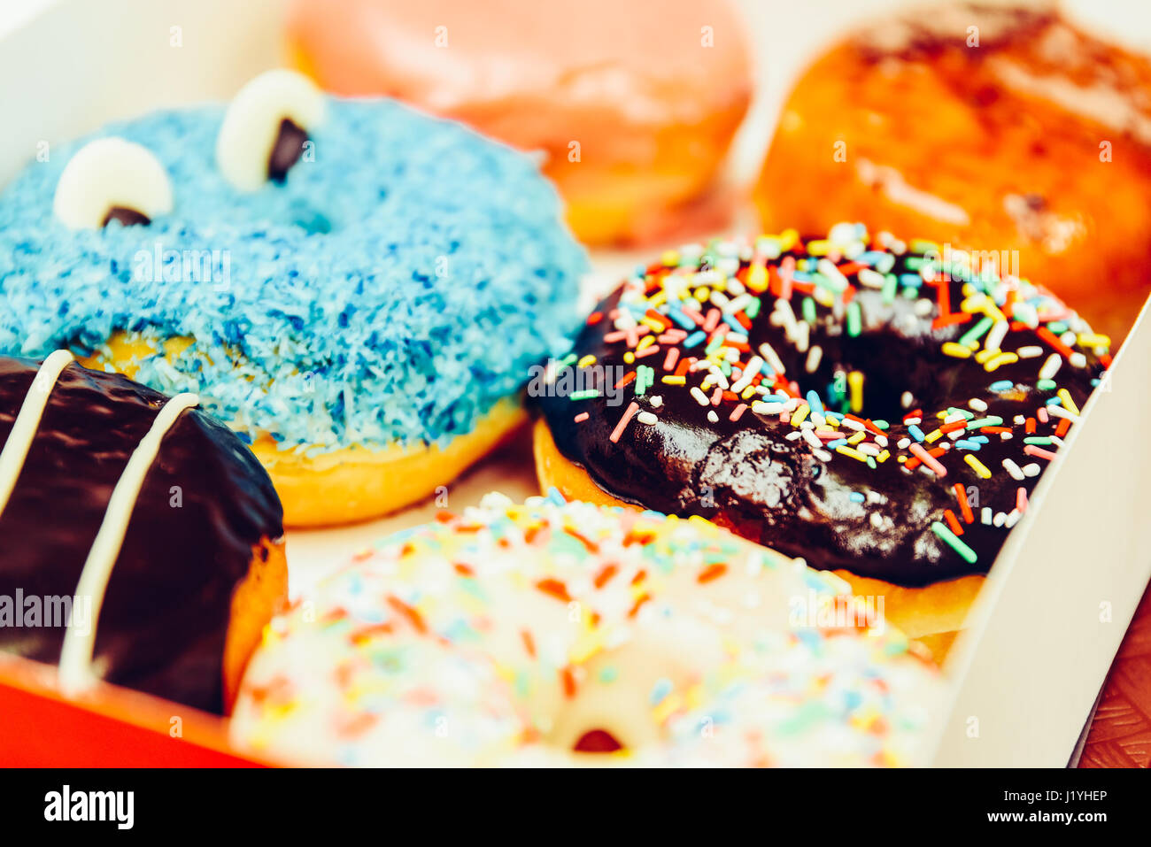 Funny Colorful Donuts In Box Stock Photo - Alamy